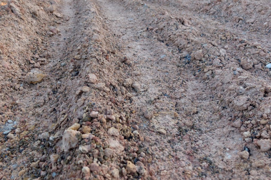 Wheel track in laterite soil excavation site, texture - Public Service ...