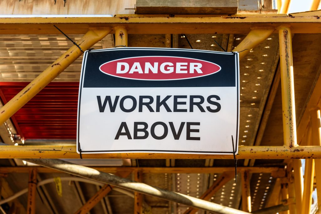 A 'Danger, Workers Above' sign - Public Service Association
